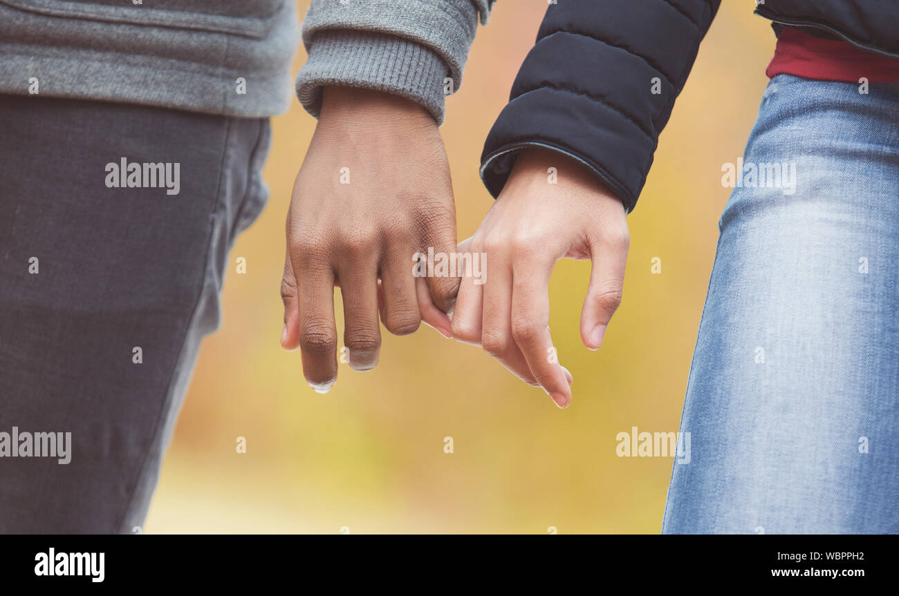 Closeup couple holding hands walking hi-res stock photography and ...