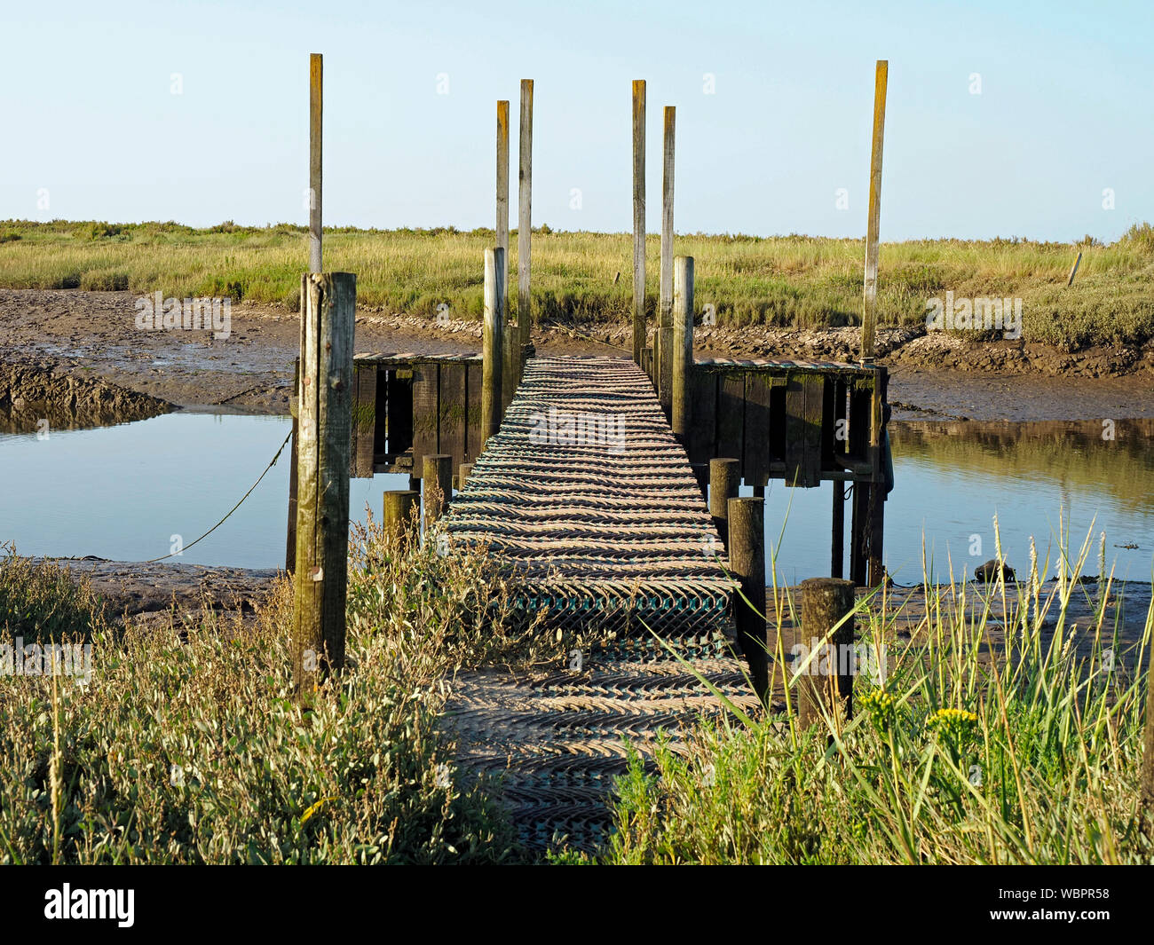 A rustic wooden jetty at Morston Creek, part of the important area of ...