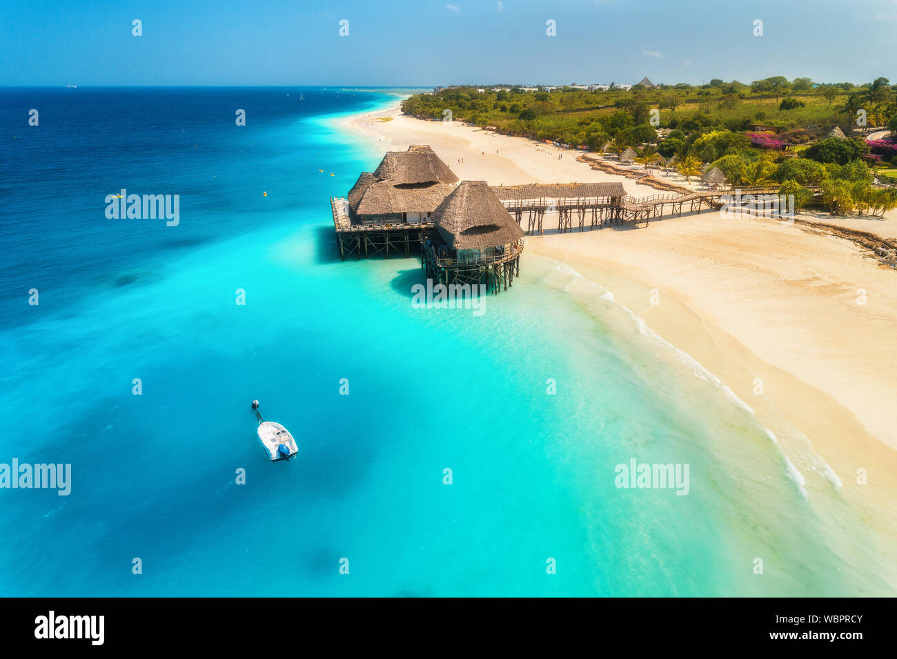 Aerial view of beautiful hotel on the water in ocean at sunset Stock ...