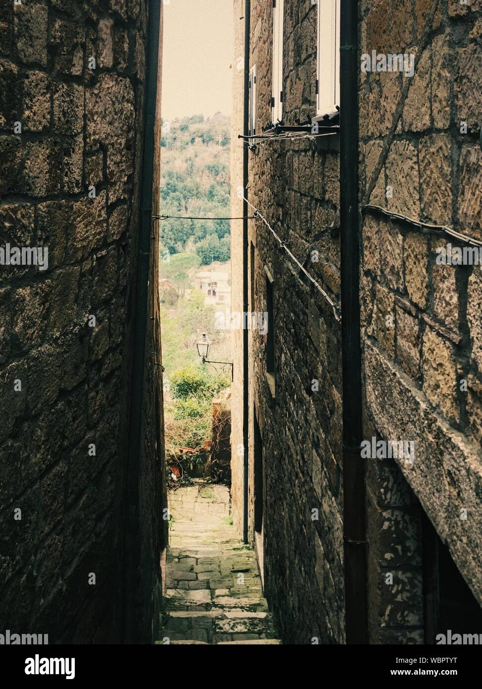 Narrow Alley Amidst Buildings Stock Photo - Alamy