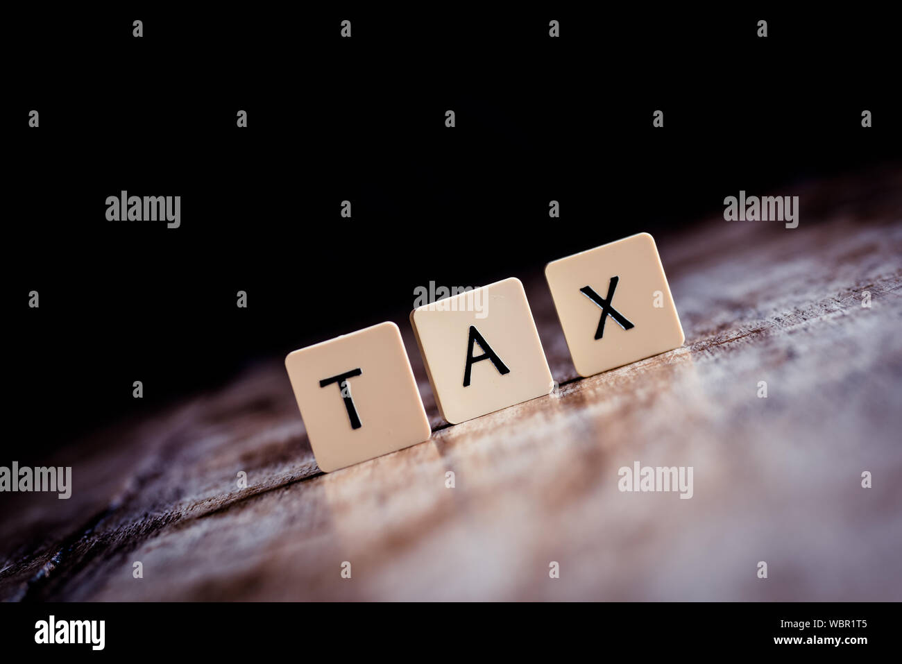 Tax word made tiles hi-res stock photography and images - Alamy