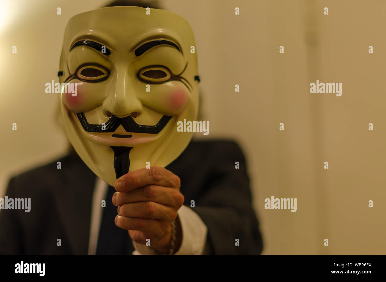 Man holding face mask hi-res stock photography and images - Alamy