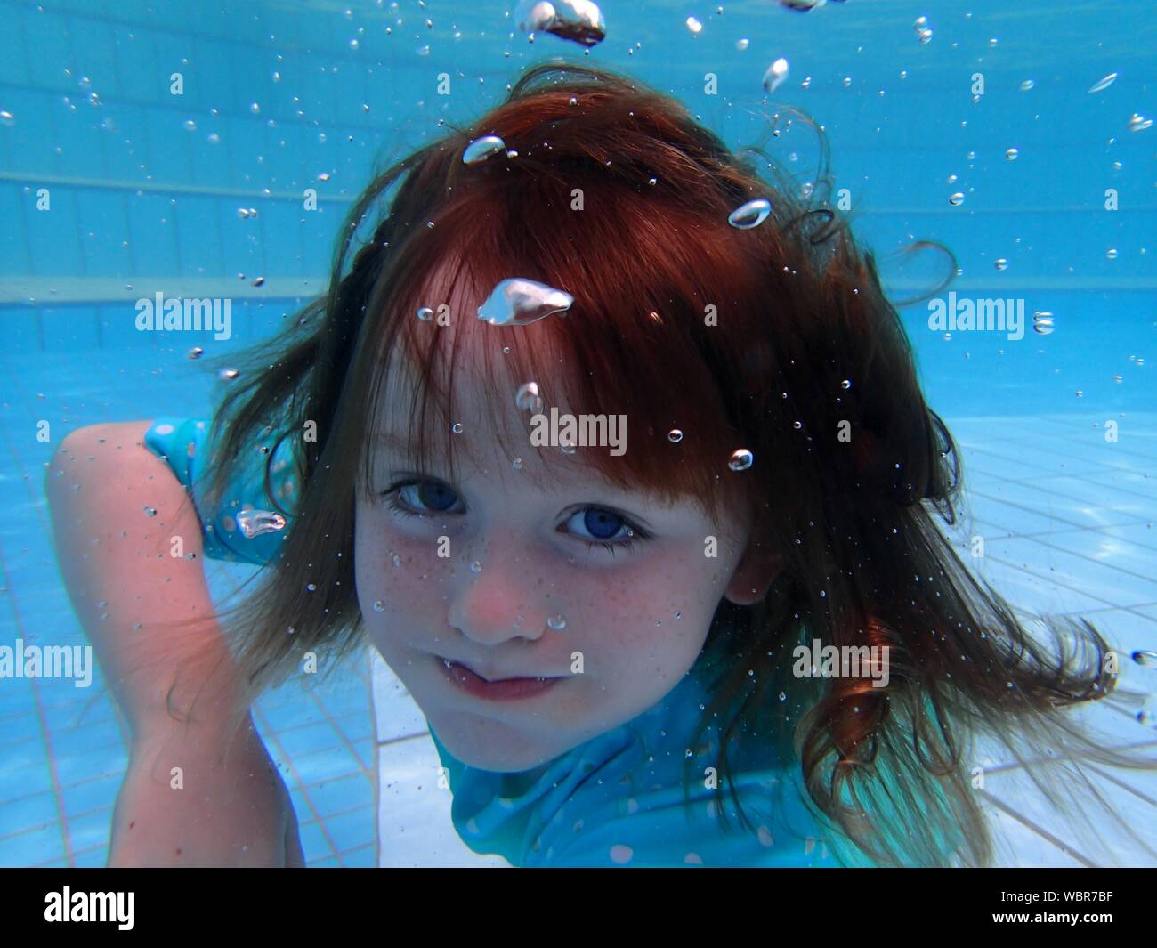 Person underwater in pool hi-res stock photography and images - Alamy
