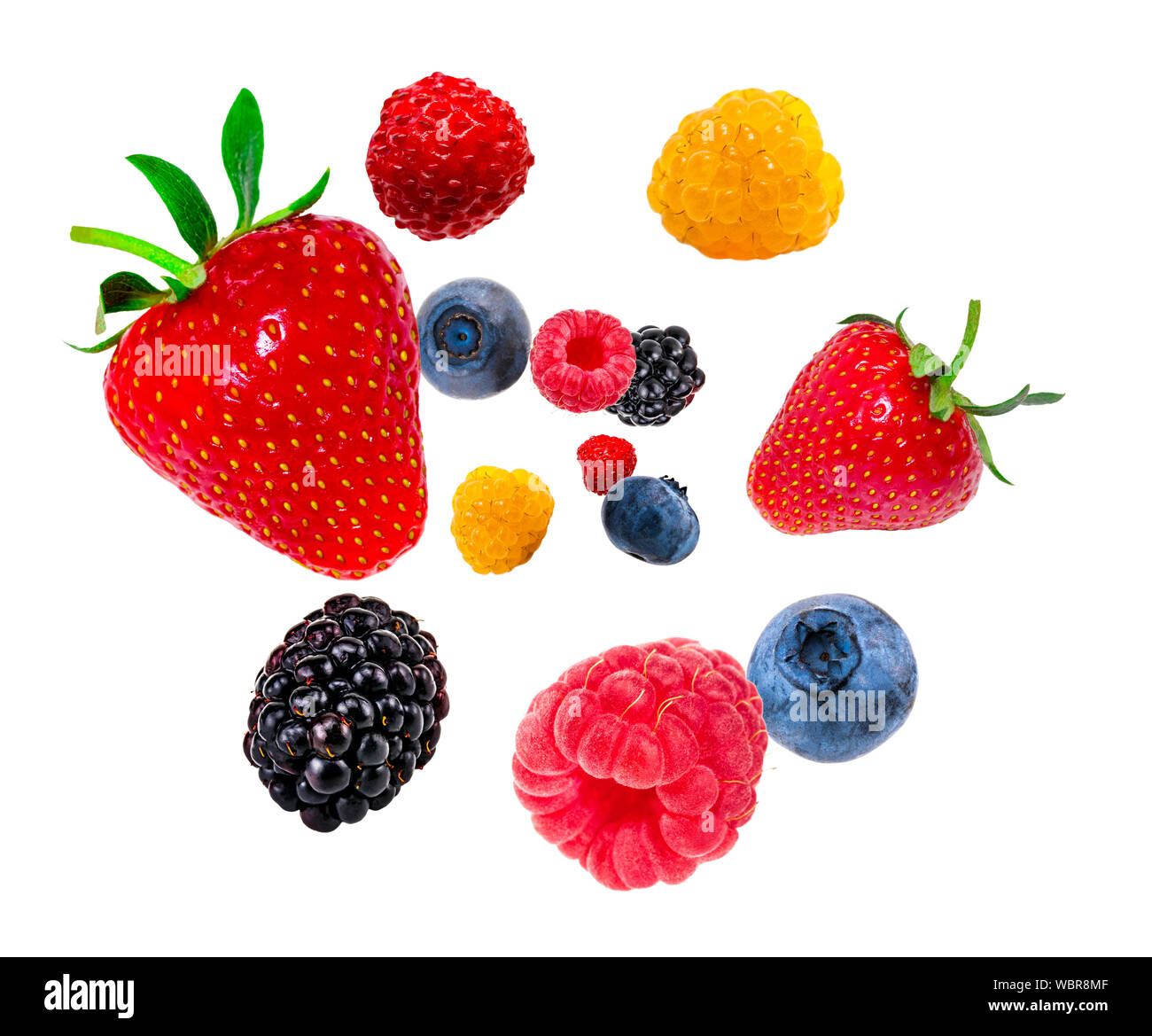 Falling berry mix isolated on a white background Stock Photo - Alamy