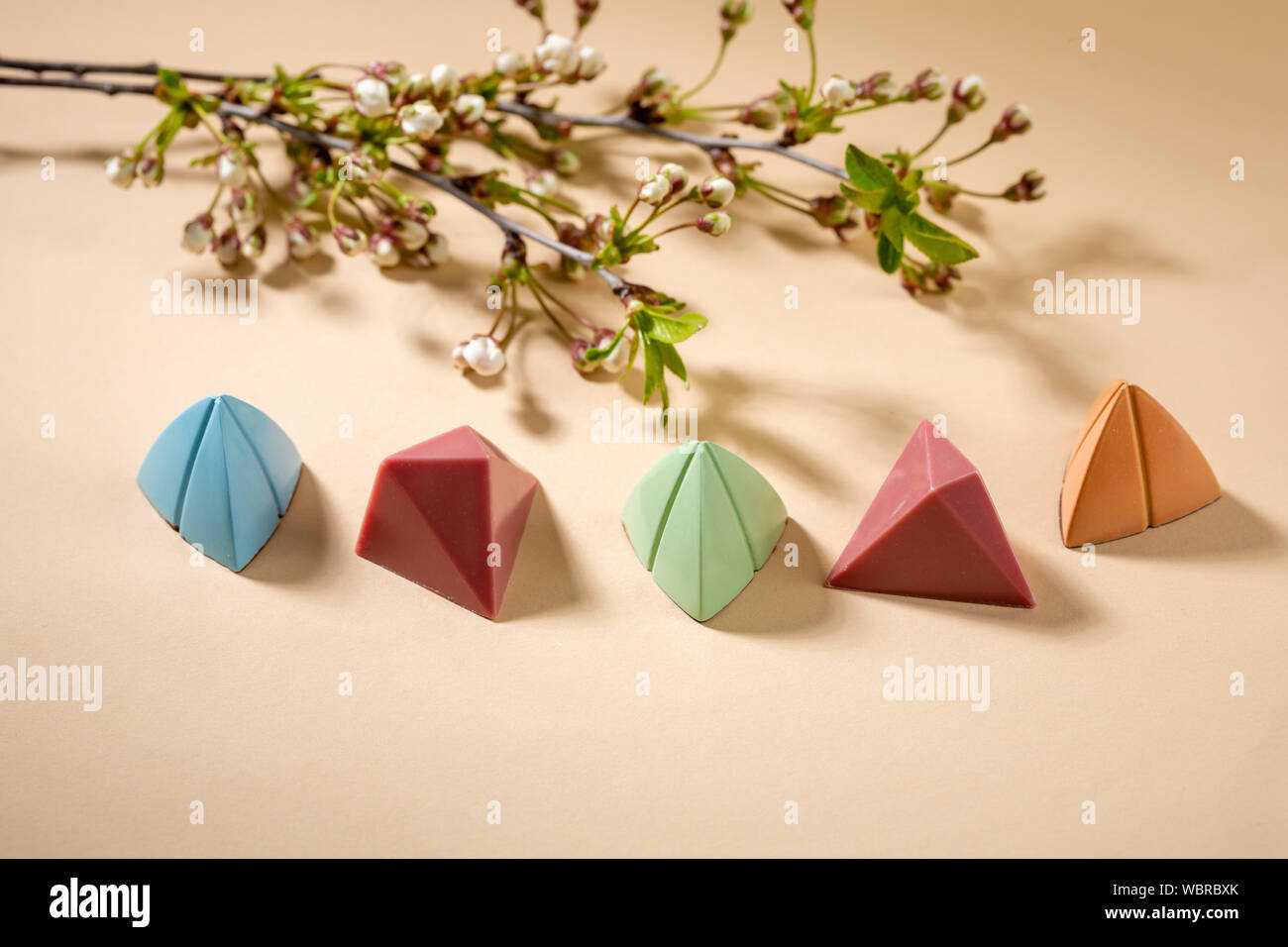 Set of chocolate candies and cherry twigs Stock Photo - Alamy