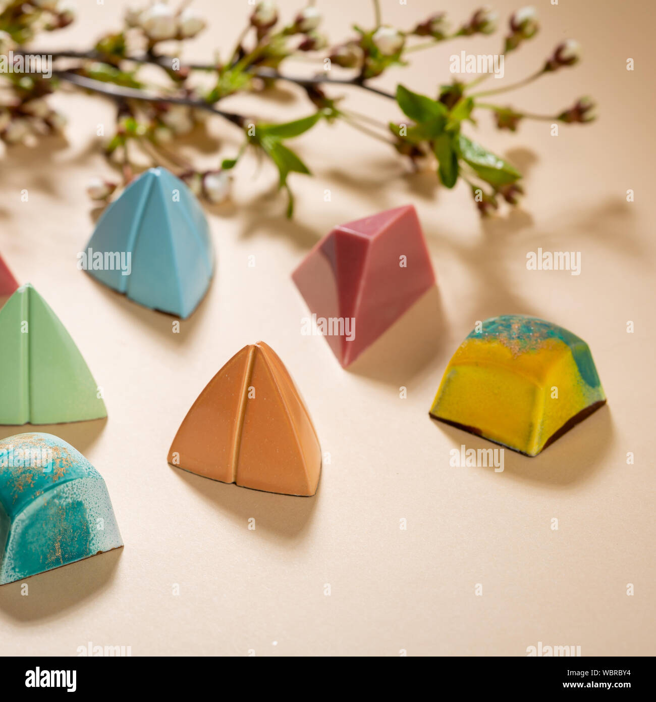 Set of chocolate candies and spring twigs Stock Photo - Alamy