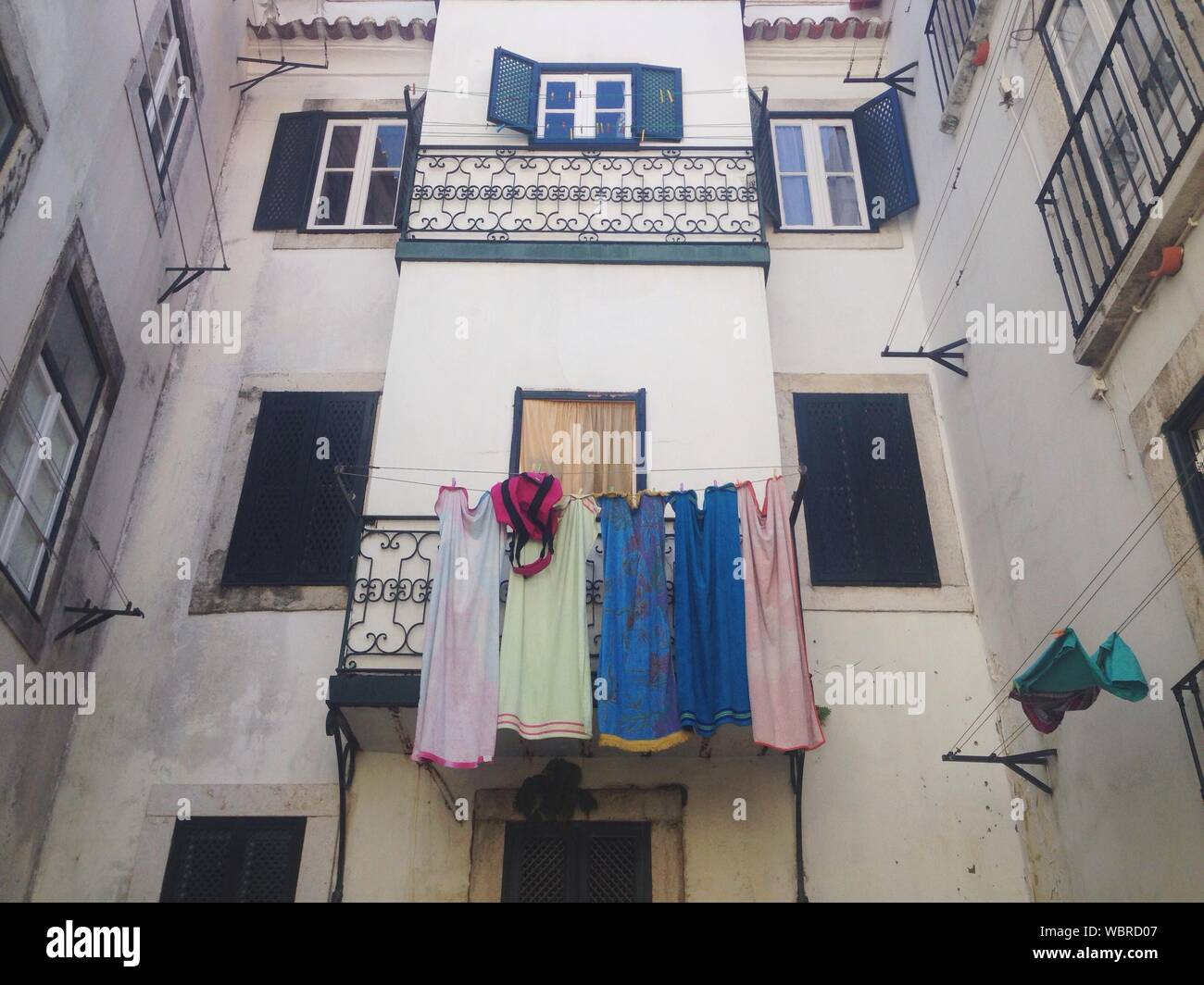 Hanging clothes on balcony hi-res stock photography and images - Alamy
