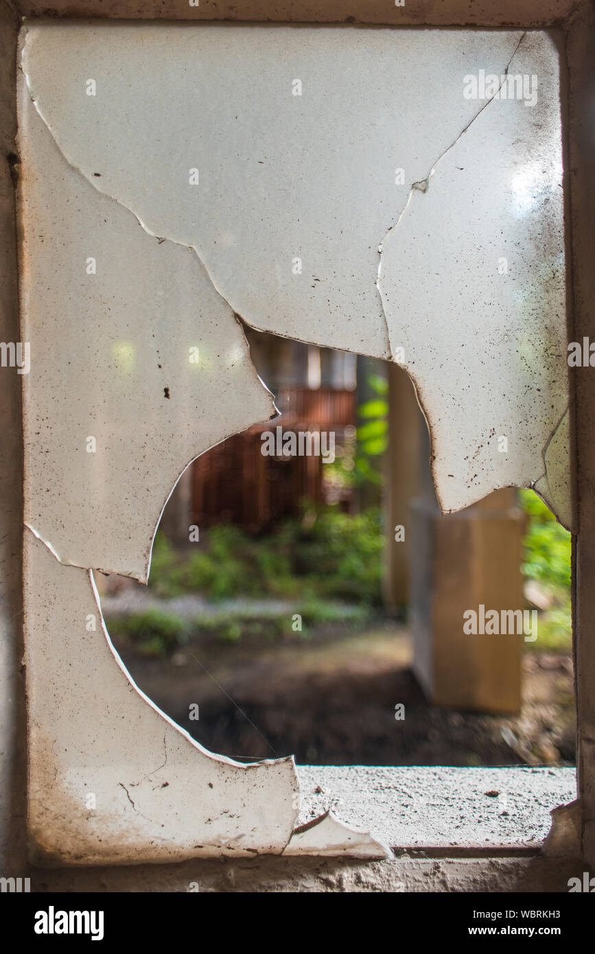 Broken vintage small window glass Stock Photo - Alamy