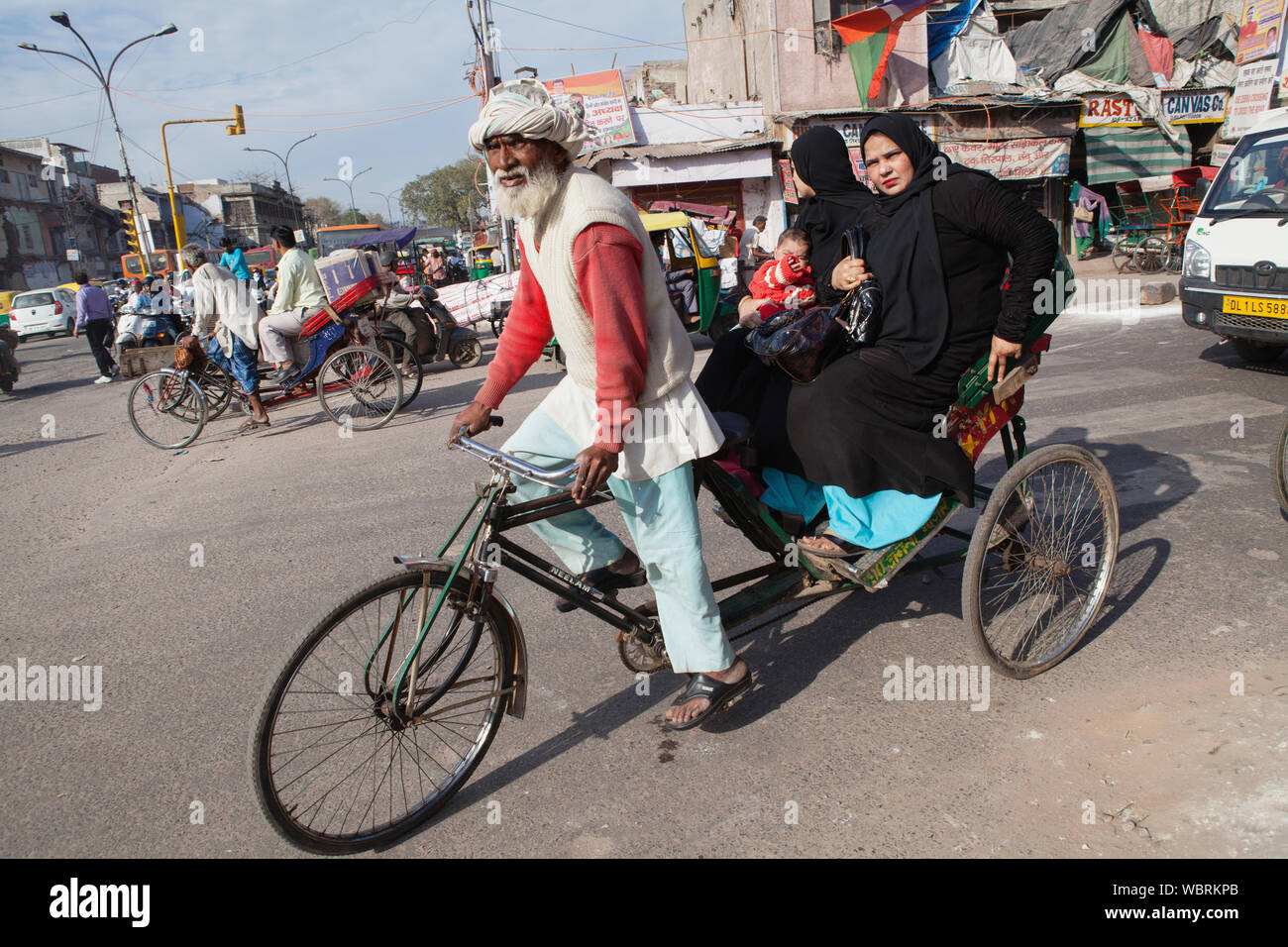 India, Delhi, Cycle rickshaw with passengers in Delhi Stock Photo - Alamy
