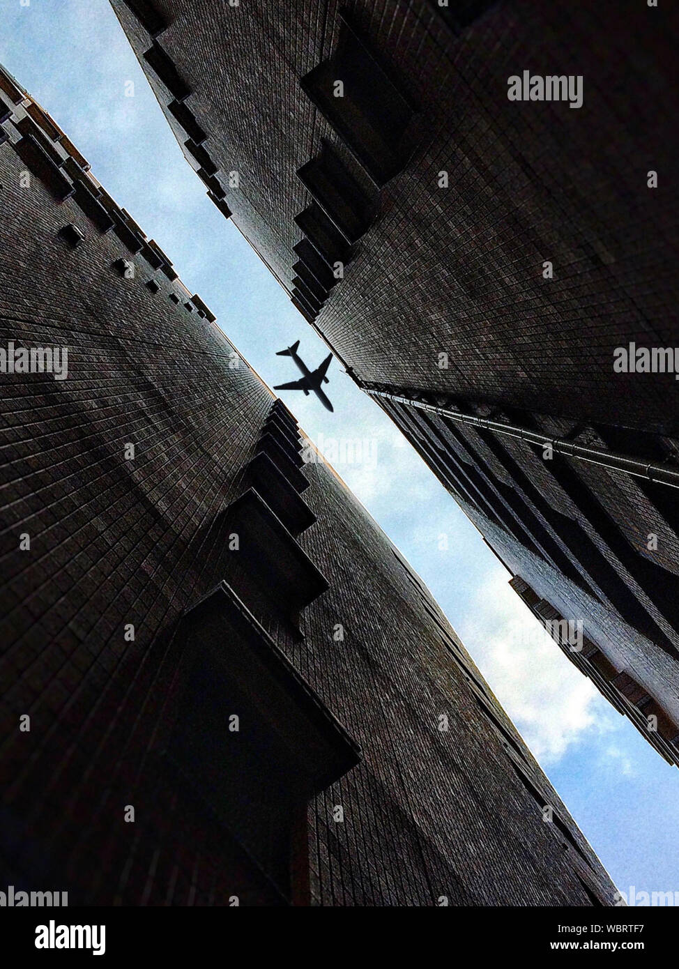 Airplane Flying Over Buildings High Resolution Stock Photography and ...