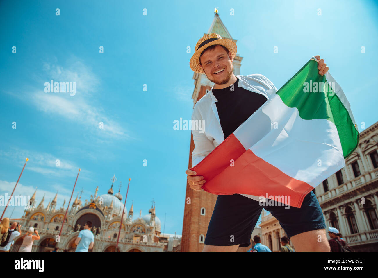 man with italian flag at saint marks square Stock Photo - Alamy