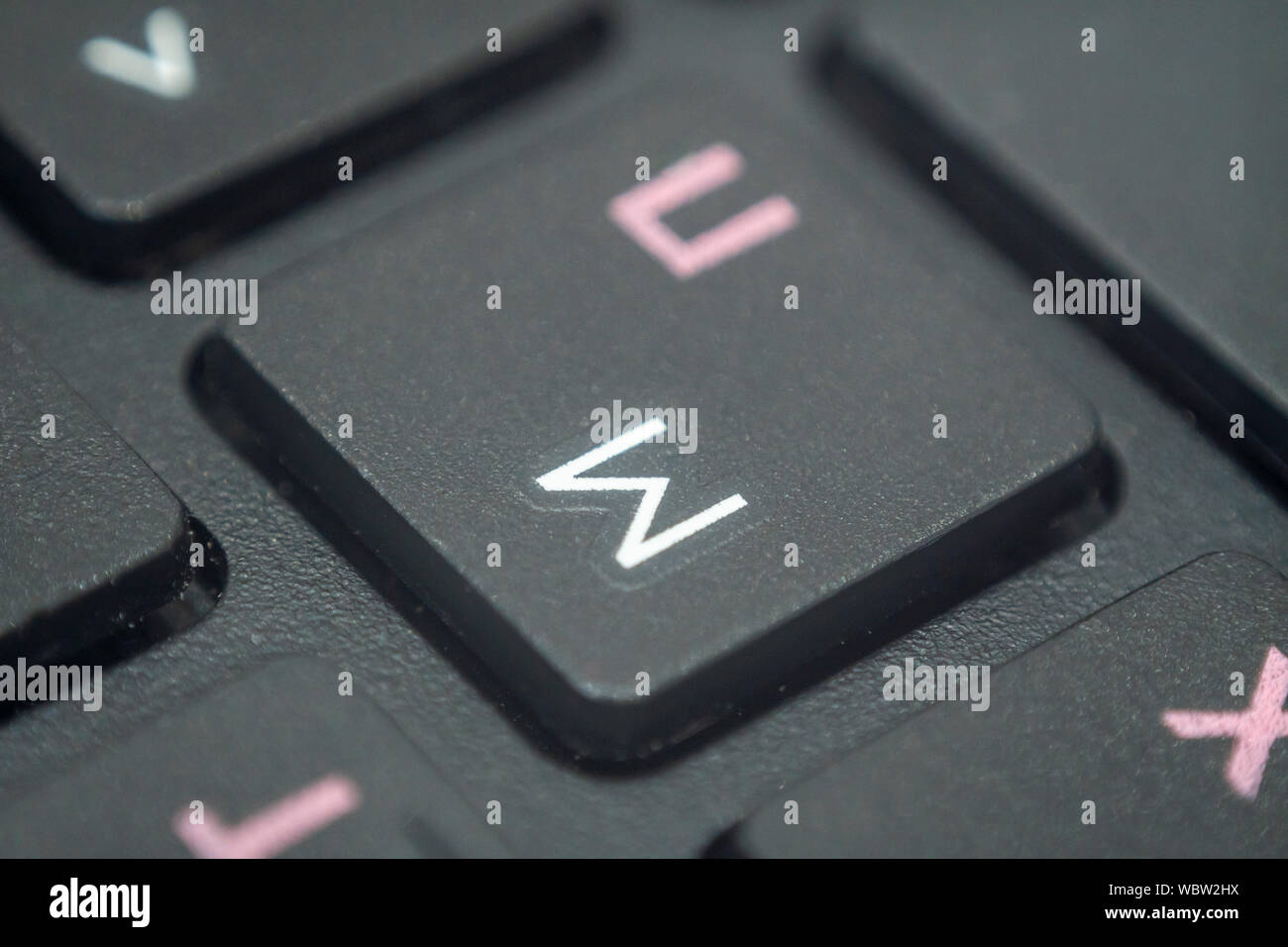 Extreme macro of the letter M on a laptop keyboard Stock Photo - Alamy