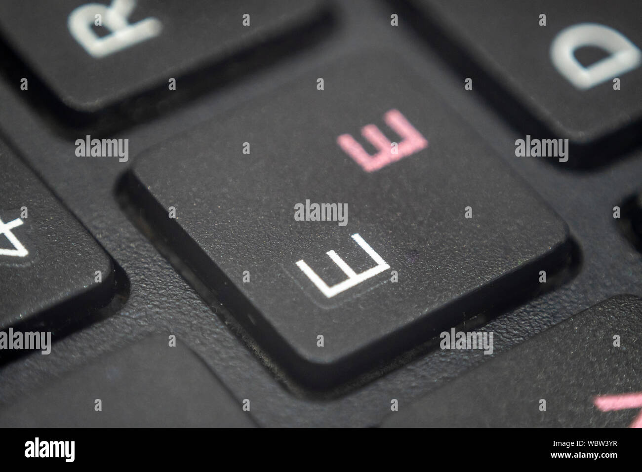 Extreme macro of the letter E on a laptop keyboard Stock Photo - Alamy