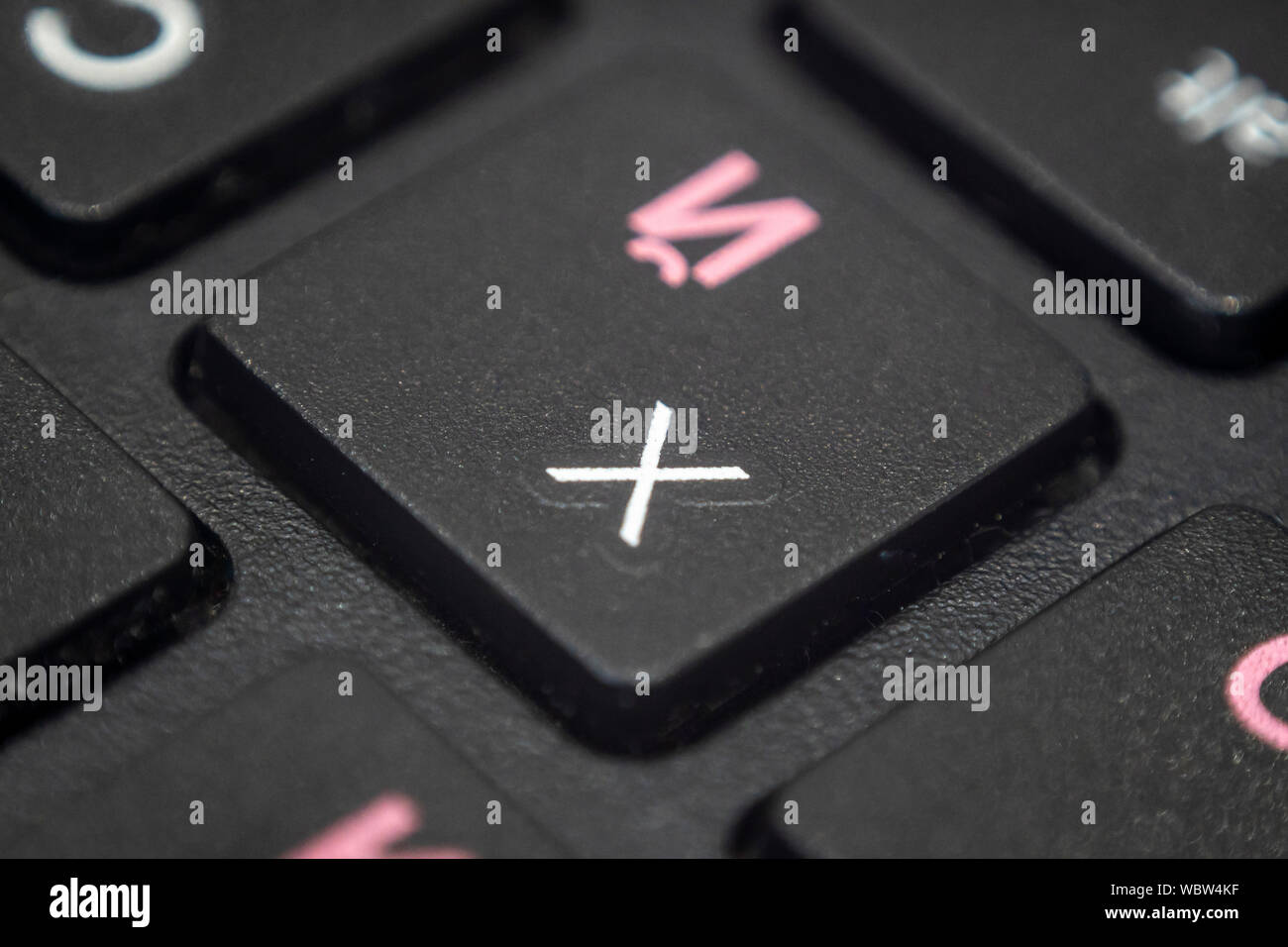 Extreme macro of the letter X on a laptop keyboard Stock Photo - Alamy