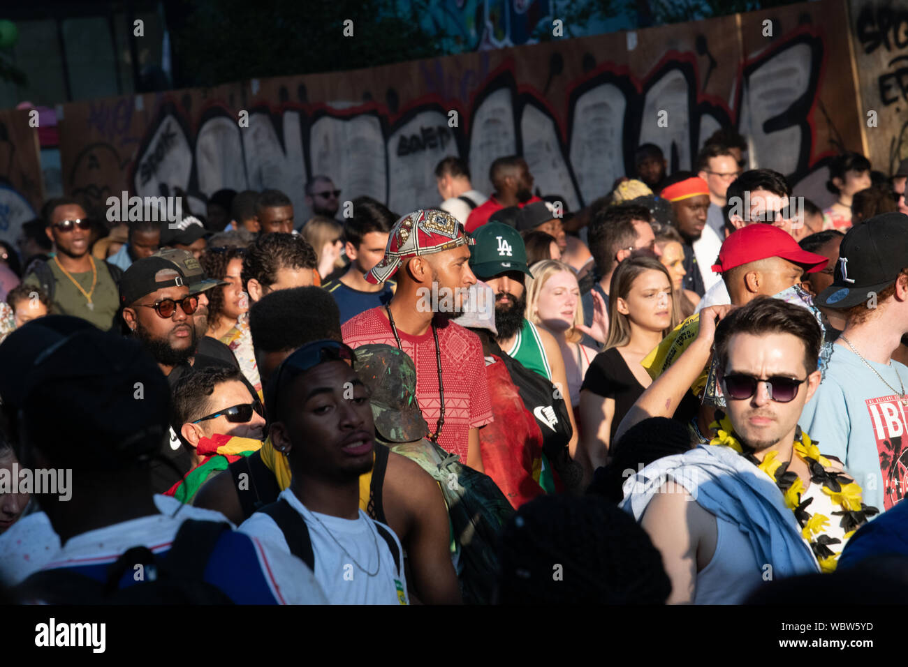 A black woman standing In the middle of a crowd at Notting Hill ...