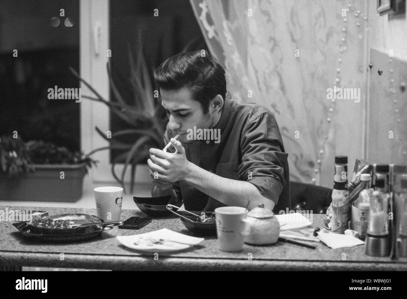 Table cigarette man hi-res stock photography and images - Alamy