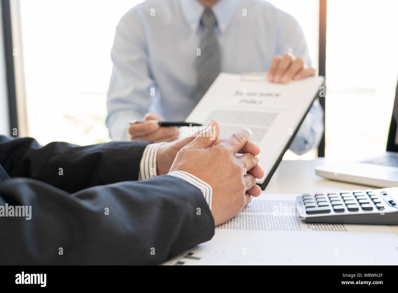 Confident insurance agent broker man holding document and present ...