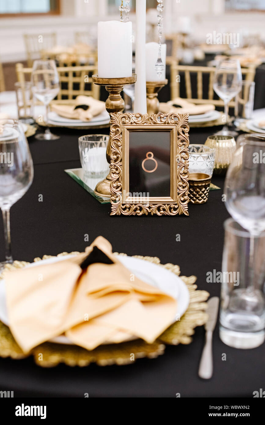 Guest table number in a golden carved frame on the dining table ...