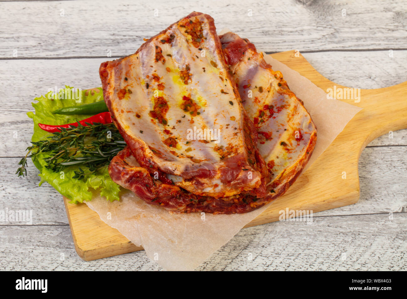 Marinated Raw pork ribs for grill Stock Photo - Alamy
