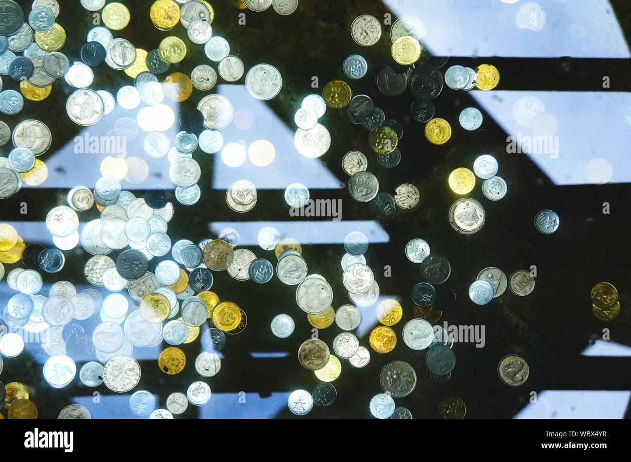 Wishing well coins hi-res stock photography and images - Alamy