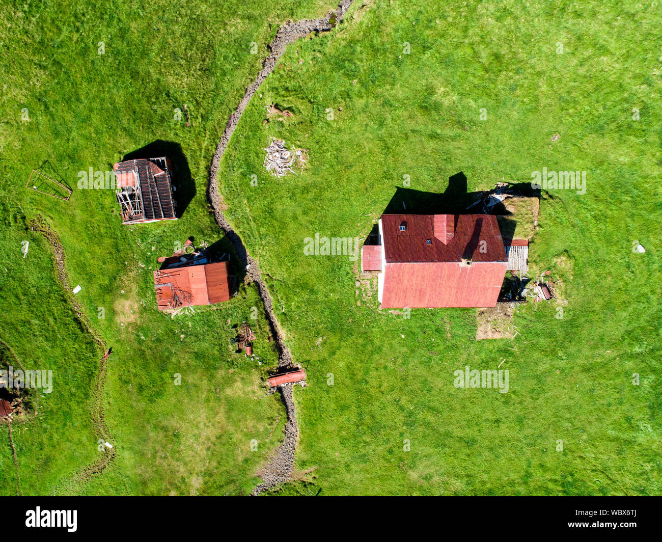Aerial image of a derelict farmhouse and field in disarray Stock Photo ...