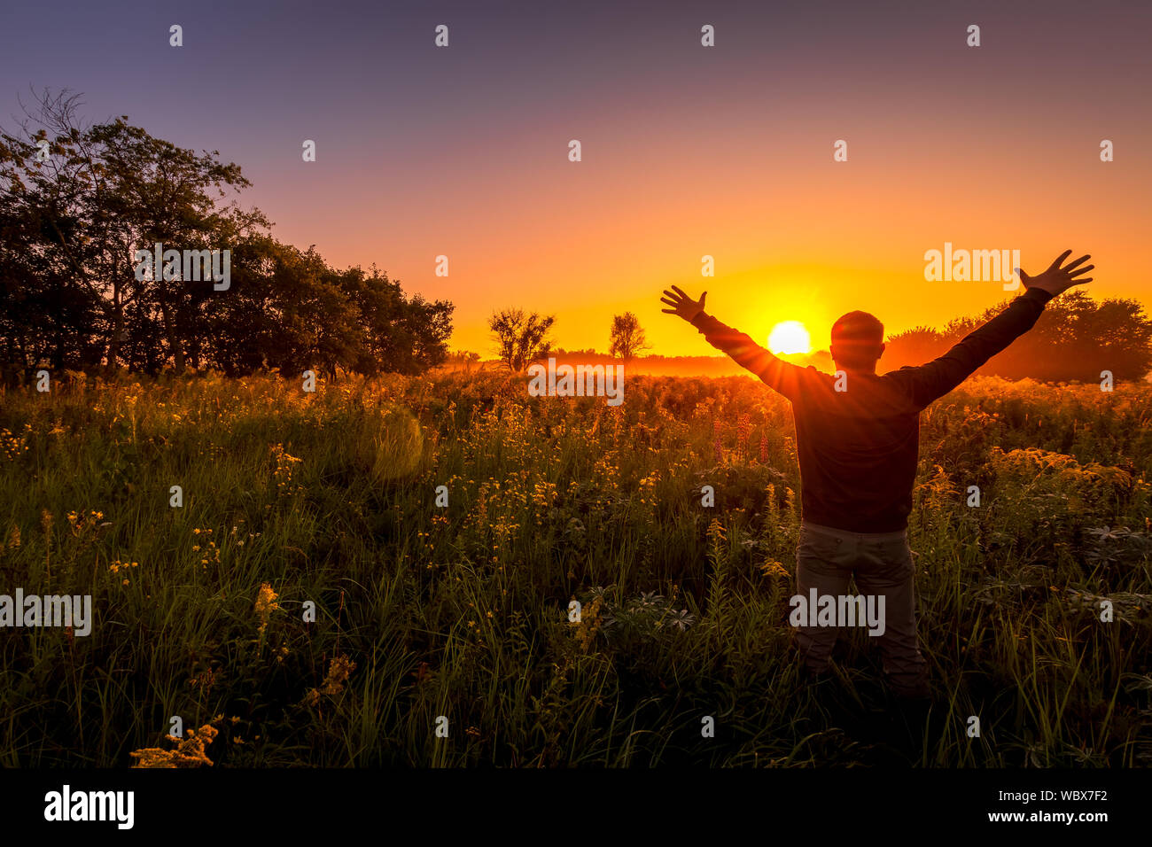 Silhouette Man Raised Hands In High Resolution Stock Photography and ...