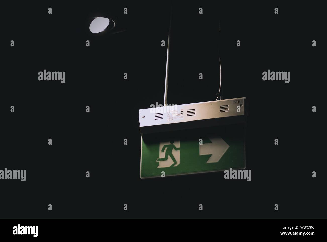 Direction to the emergency exit hi-res stock photography and images - Alamy