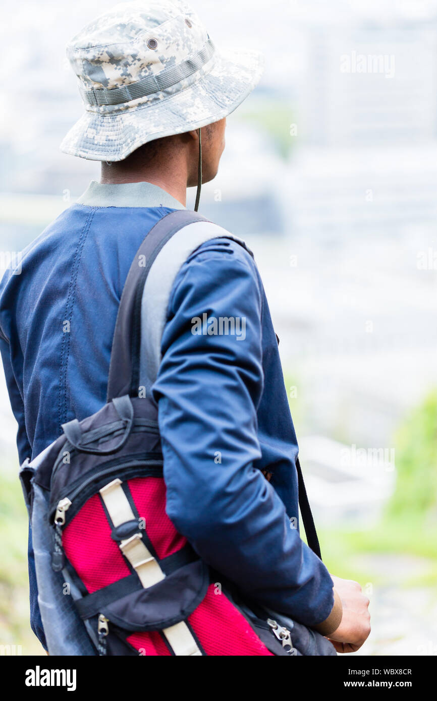 Rear view of boy with his backpack Stock Photo - Alamy