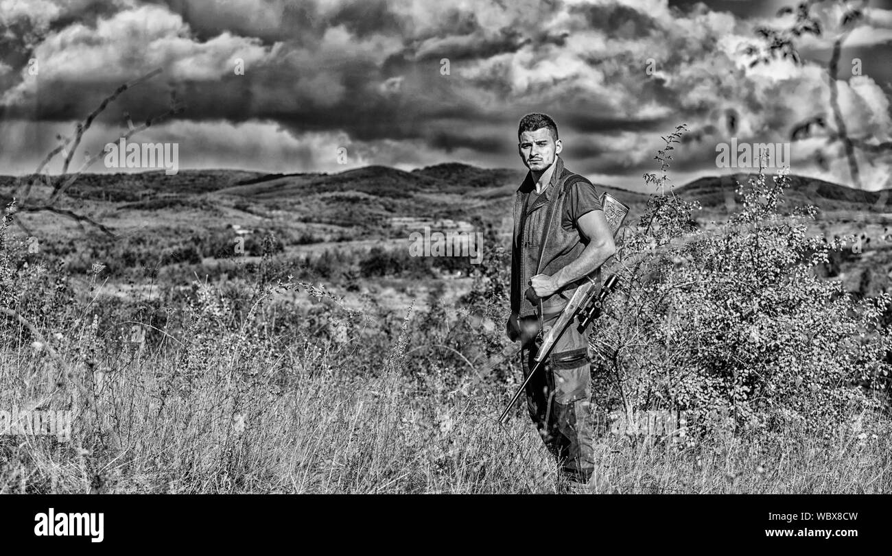 Hunting hobby concept. Regulation of hunting. Man muscular brutal guy ...