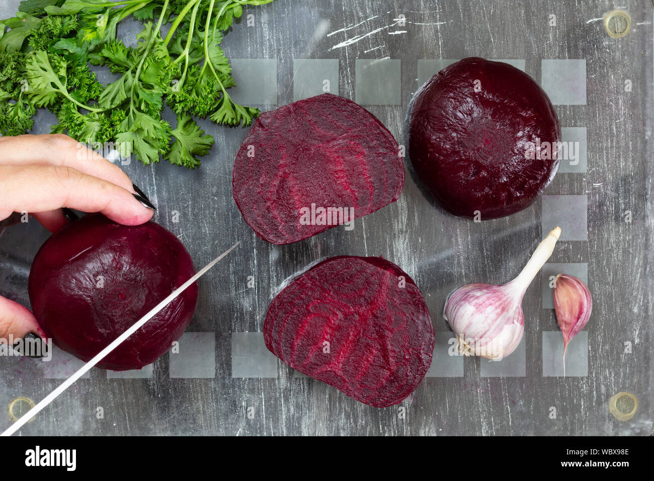 Woman cutting fresh beet greens hi-res stock photography and images - Alamy