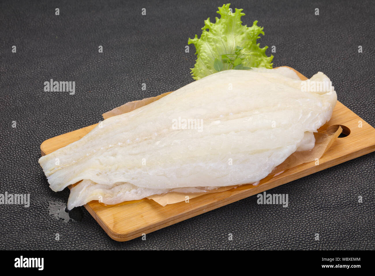 Raw halibut fillet ready for cooking Stock Photo - Alamy