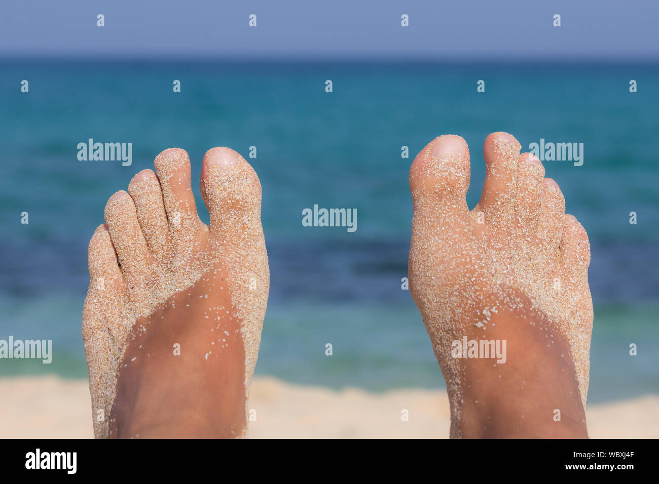 Sandy beach feet hi-res stock photography and images - Alamy