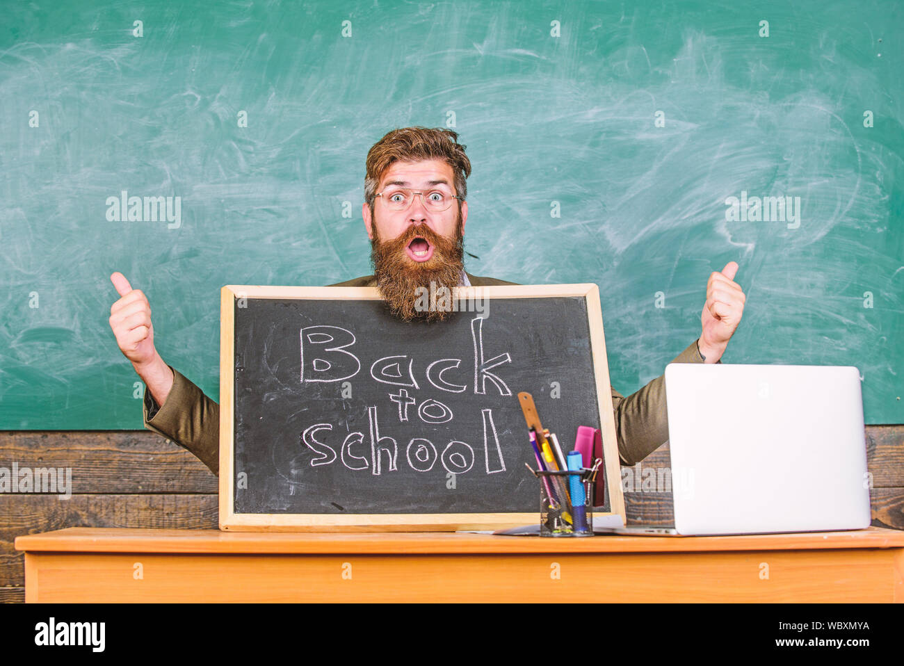 Beginning of new school year in september. Teacher welcomes new pupils ...