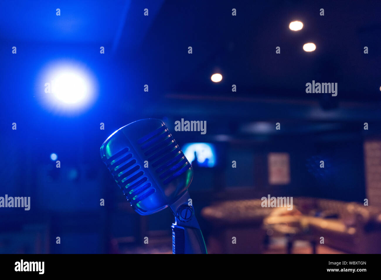 Retro music microphone on stage in a night club. Show or performance ...