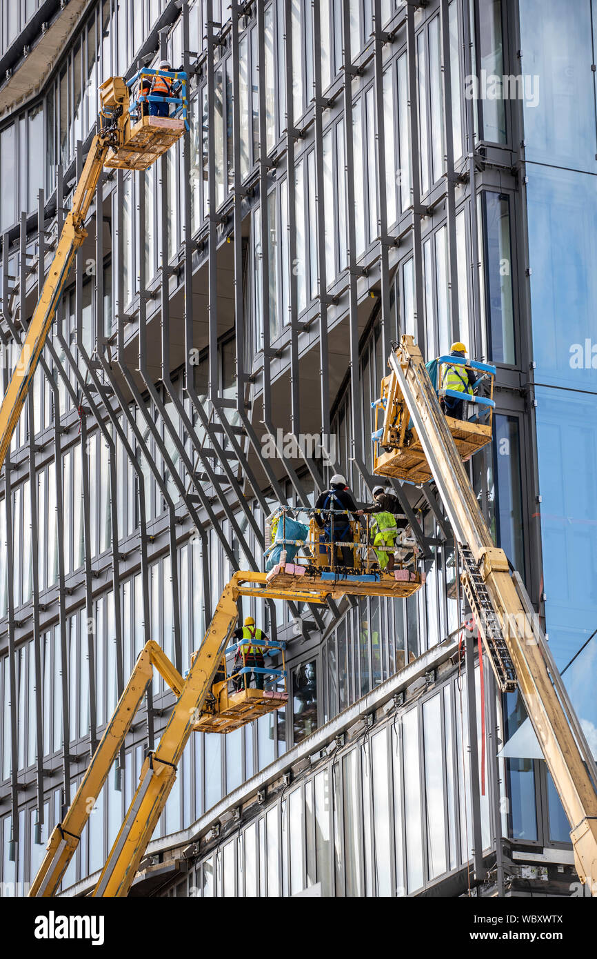 Construction site, facades Work on the new Cube building, at the main ...