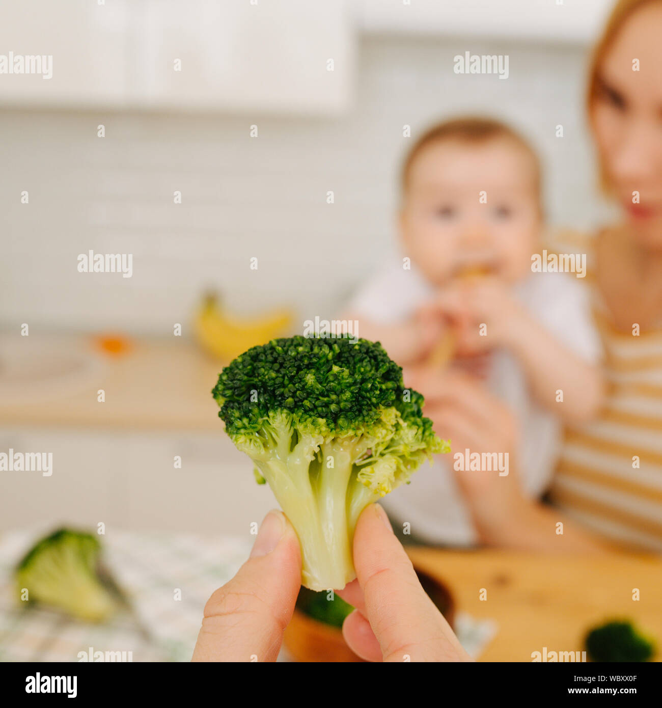 Active restless infant child is given food Stock Photo - Alamy