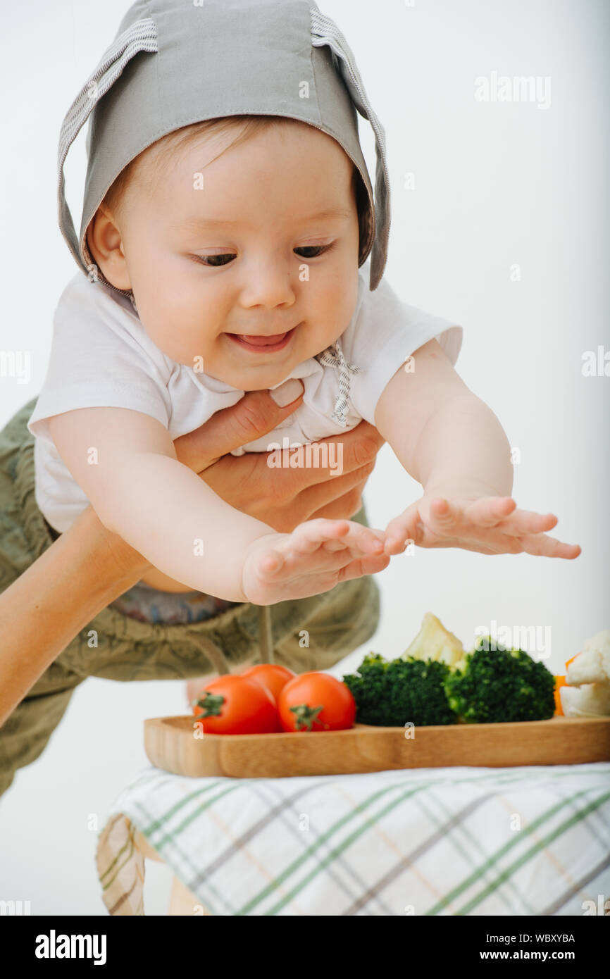 Active restless infant child is presented food Stock Photo - Alamy