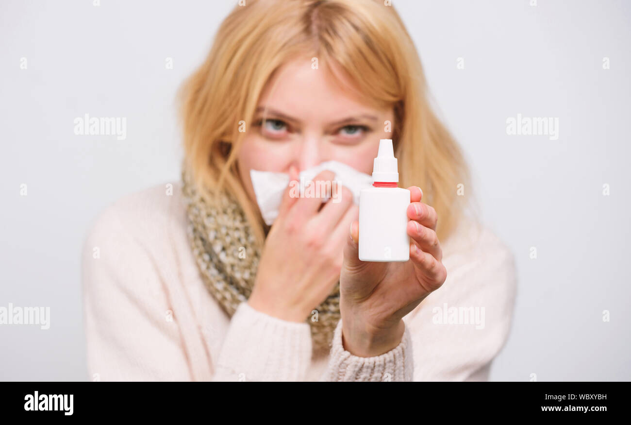 Relieving itchy nose. Cute woman nursing nasal cold or allergy. Sick ...