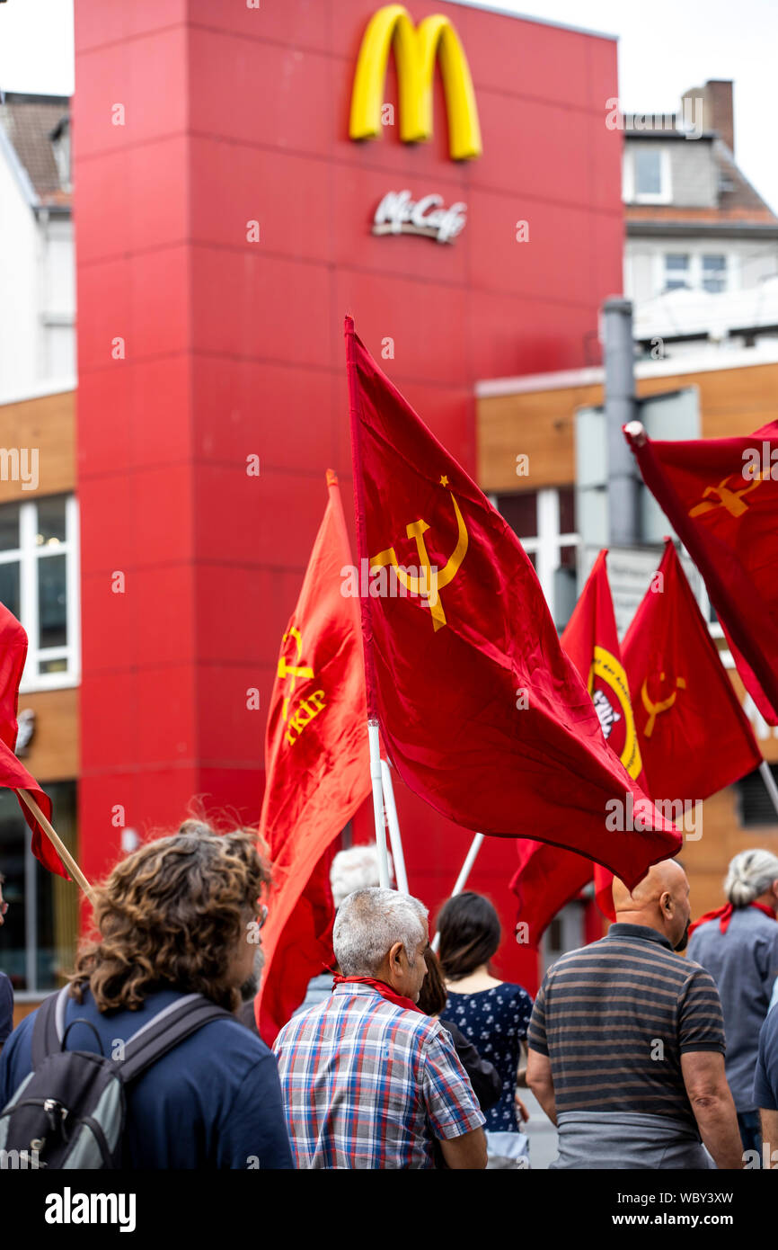 Demonstration of left-wing groups, red flags of communist parties ...