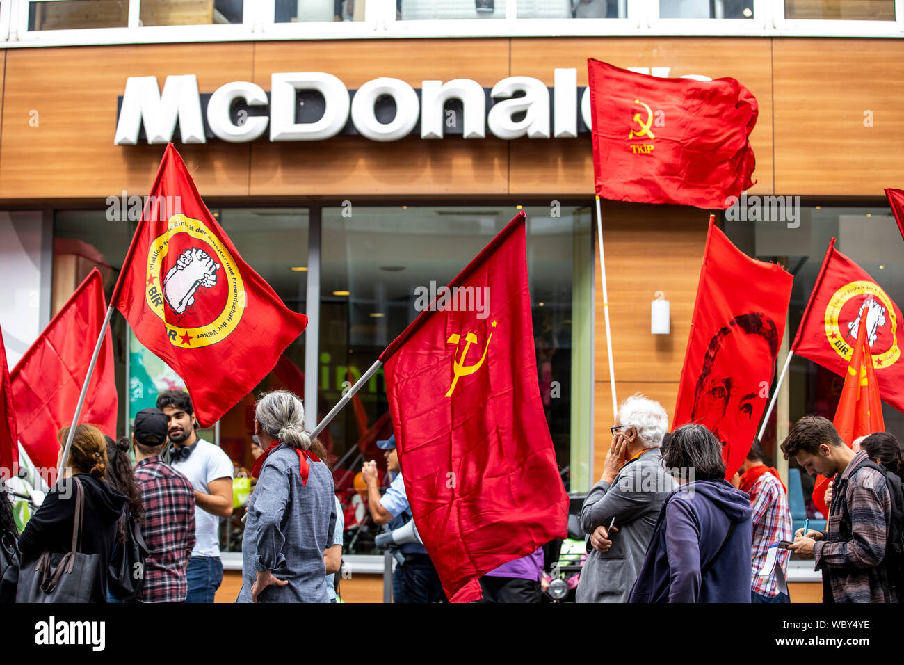 Demonstration of left-wing groups, red flags of communist parties ...