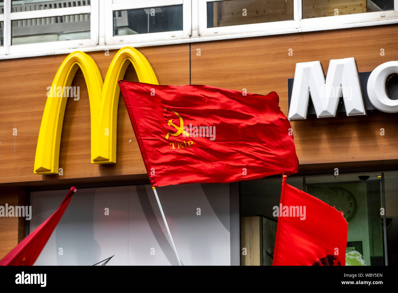 Demonstration of left-wing groups, red flags of communist parties ...