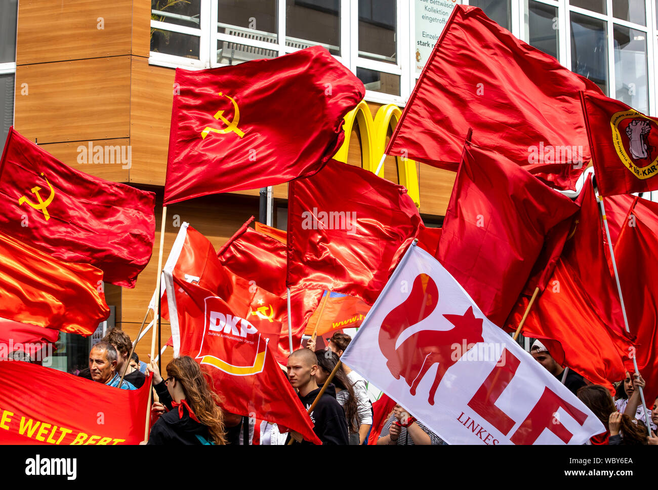 Demonstration of left-wing groups, red flags of communist parties ...