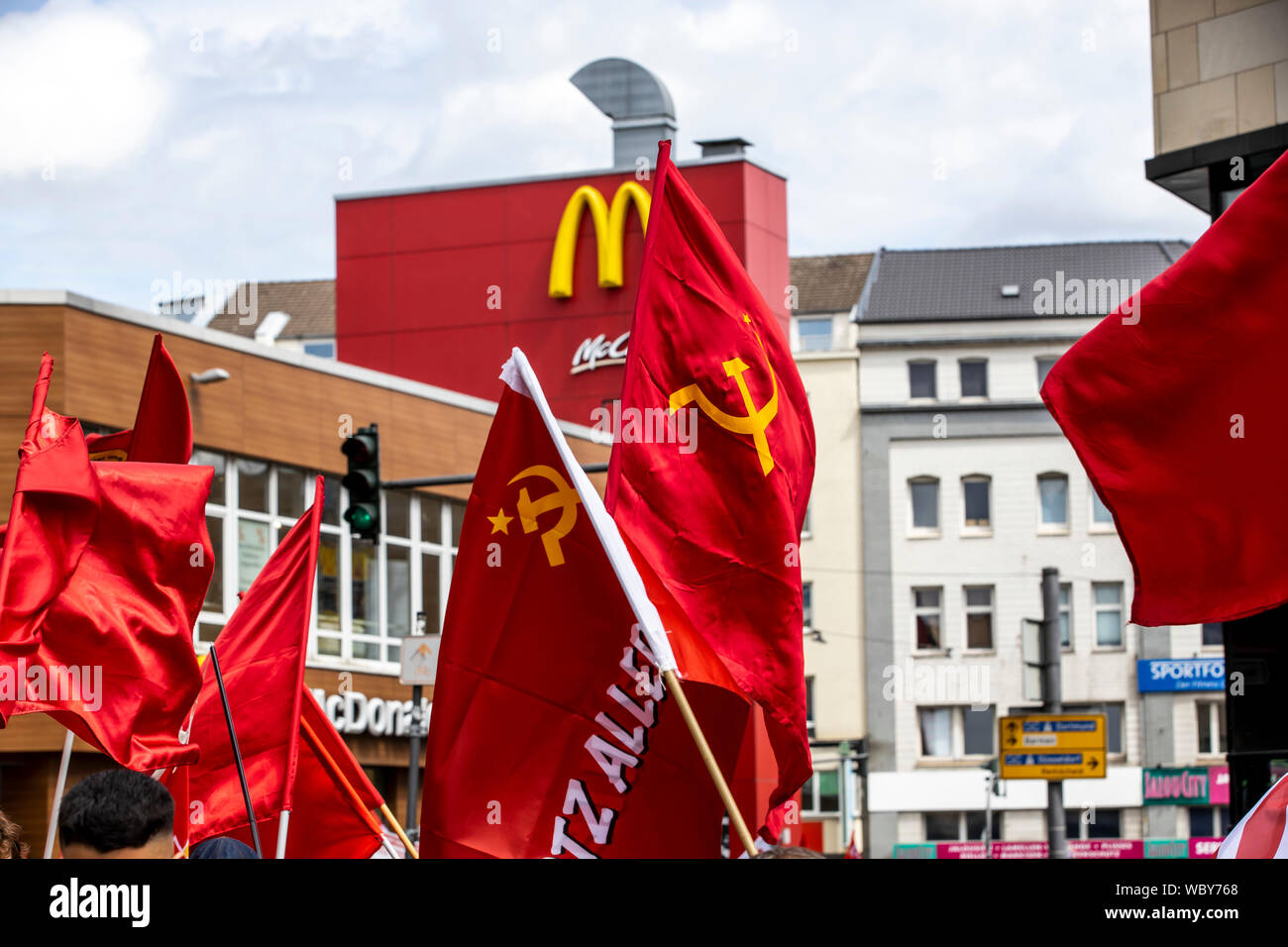 Demonstration of left-wing groups, red flags of communist parties ...