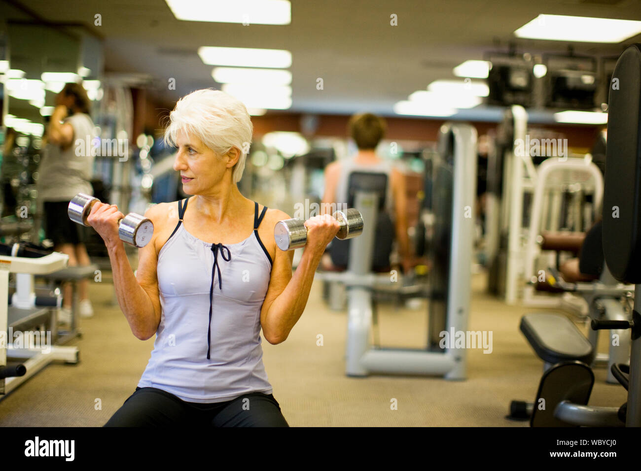 Mature woman working out at the gym Stock Photo - Alamy