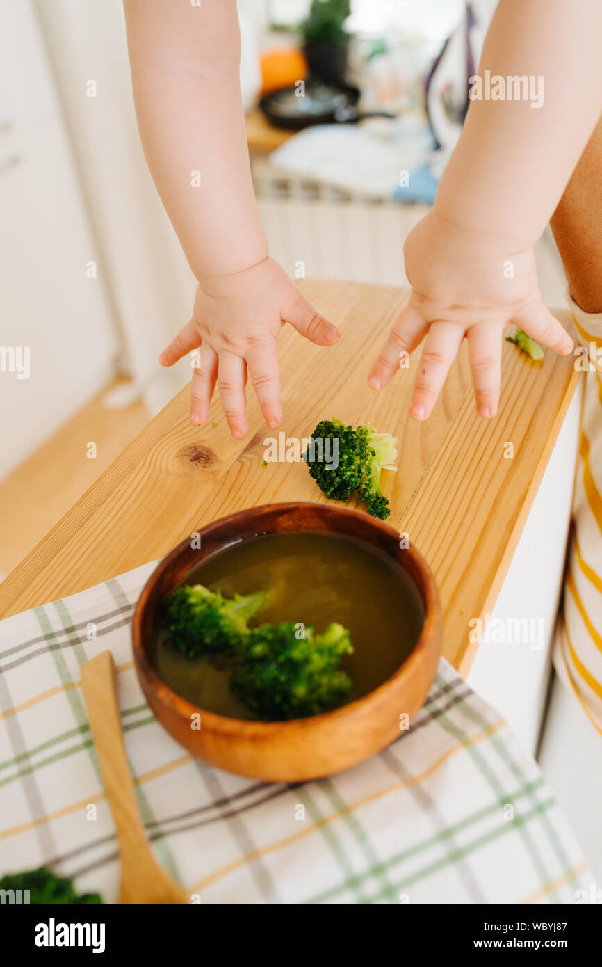 Active restless infant child is given food Stock Photo - Alamy