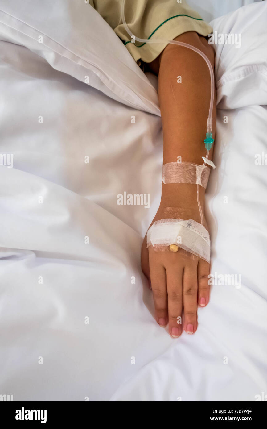 Patient in hospital in bed with intravenous medicine close up Stock ...