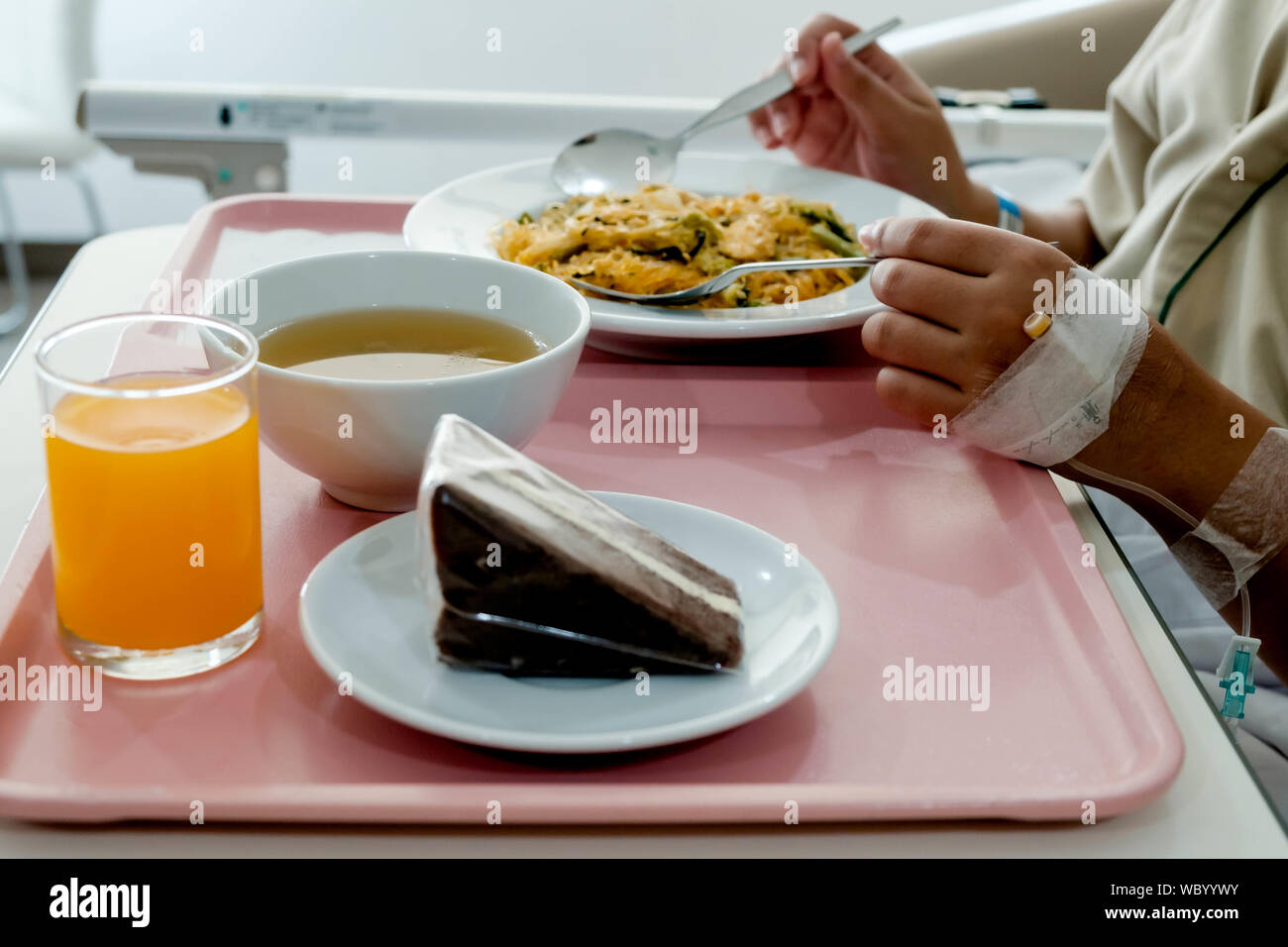Patient in hospital with food, recovering in bed close up Stock Photo ...