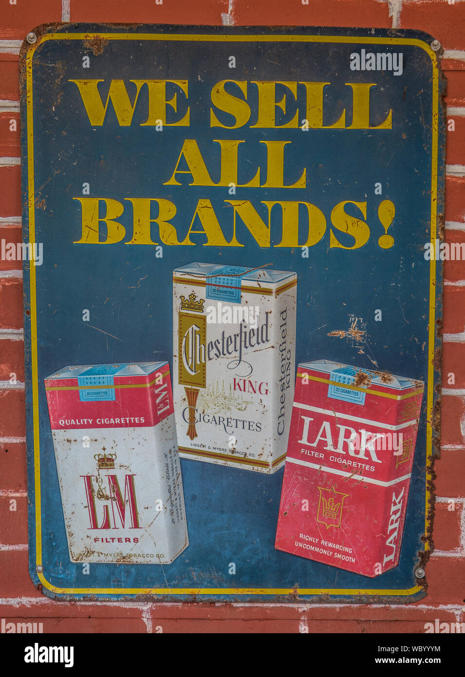 Vintage cigarette advertising sign on a wall of a abandoned building ...