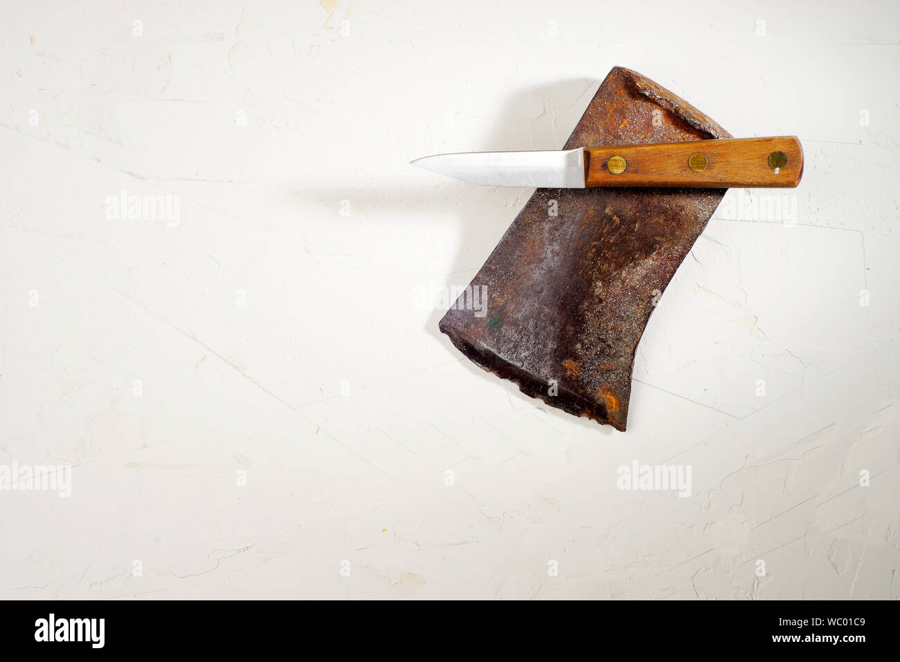 Old ax head and new kitchen knife isolated on white background Stock ...