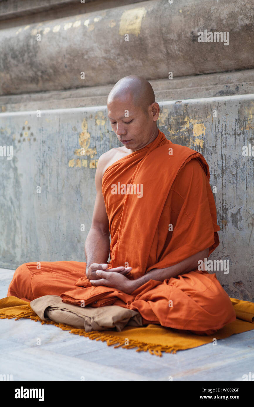India, Bihar, Bodhgaya, A Buddhist Monk in meditation at the Mahabodhi ...